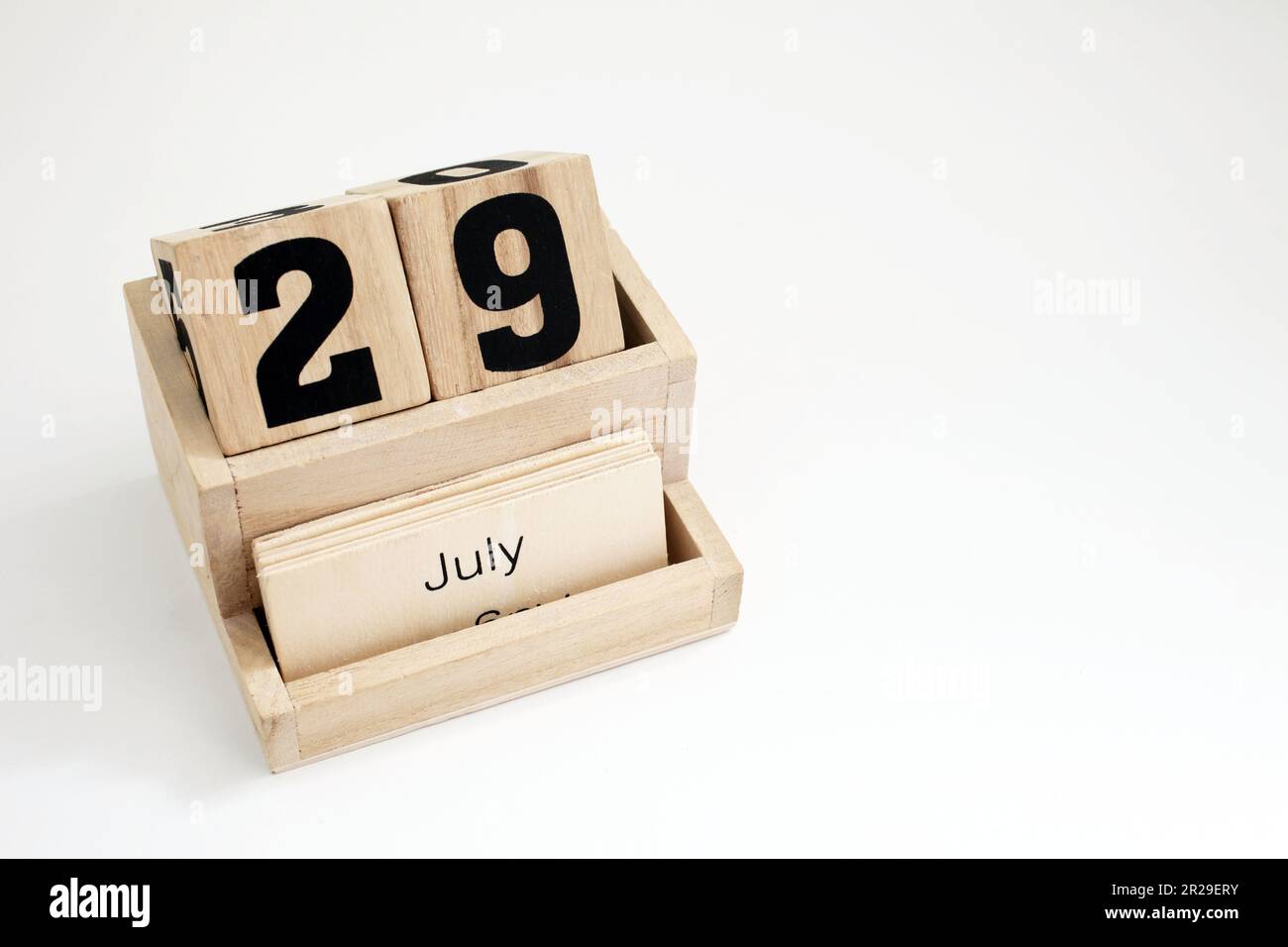 Wooden perpetual calendar showing the 29th of July Stock Photo - Alamy