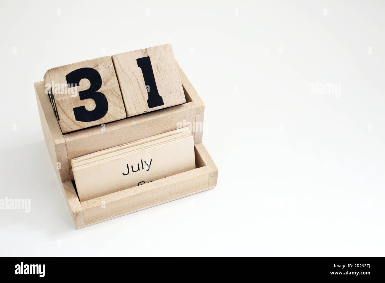 Wooden perpetual calendar showing the 31st of July Stock Photo - Alamy