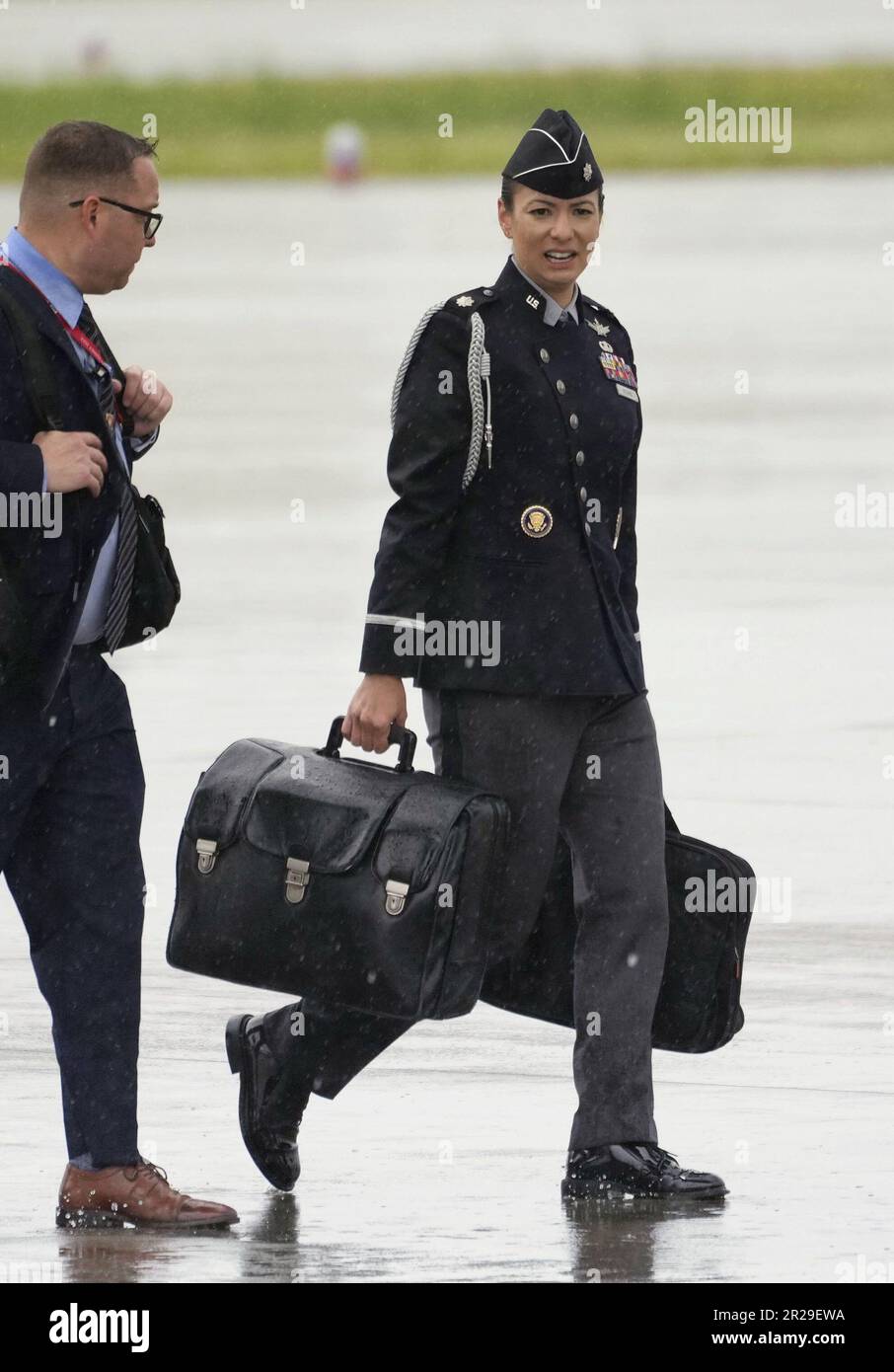 A U.S. military aide carries a briefcase known as the "nuclear football ...