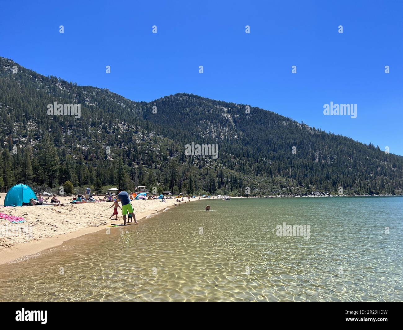 Beach tents and people are visible on Main Beach at Sand Harbor, Lake ...