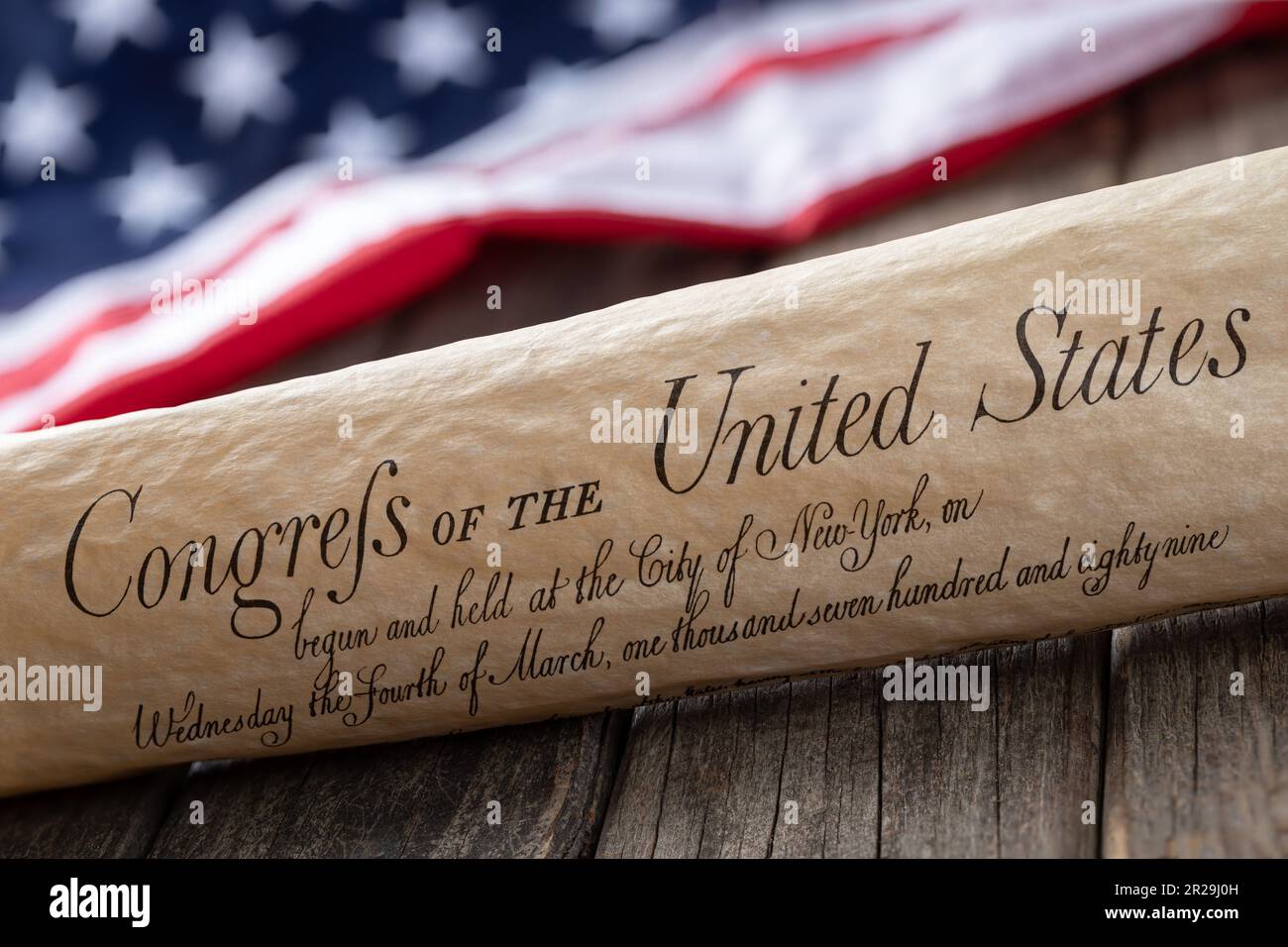 United States Bill of Rights with American flag in background on rustic ...