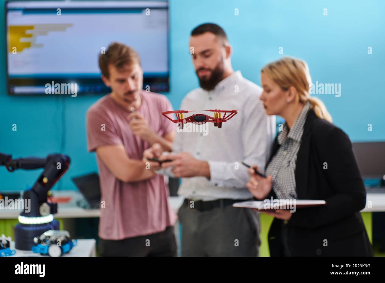 A group of students working together in a laboratory, dedicated to ...