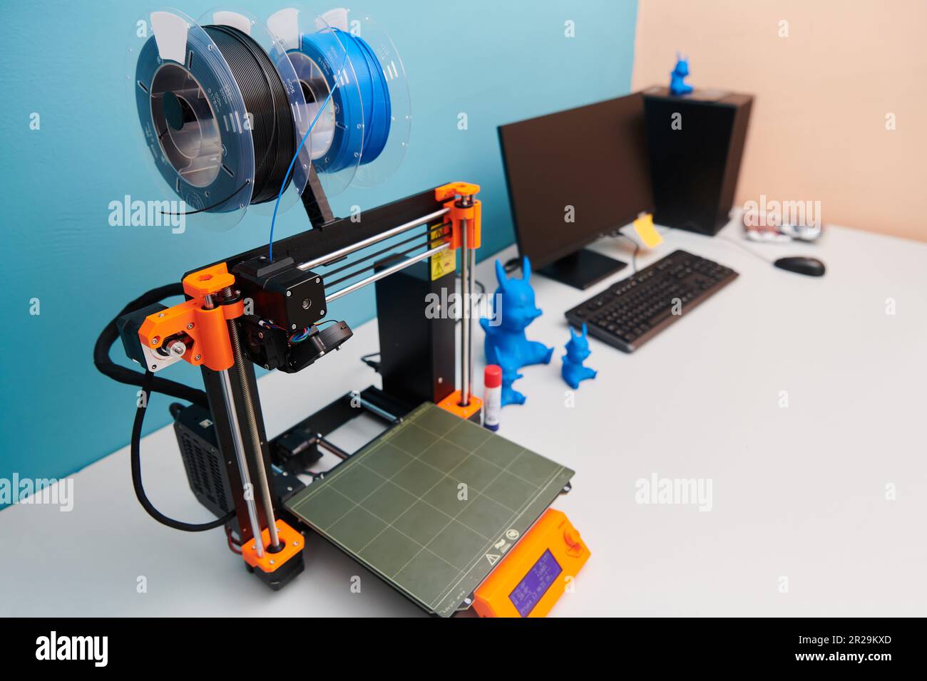 Modern 3d printer for creating 3d models and materials on the table in ...