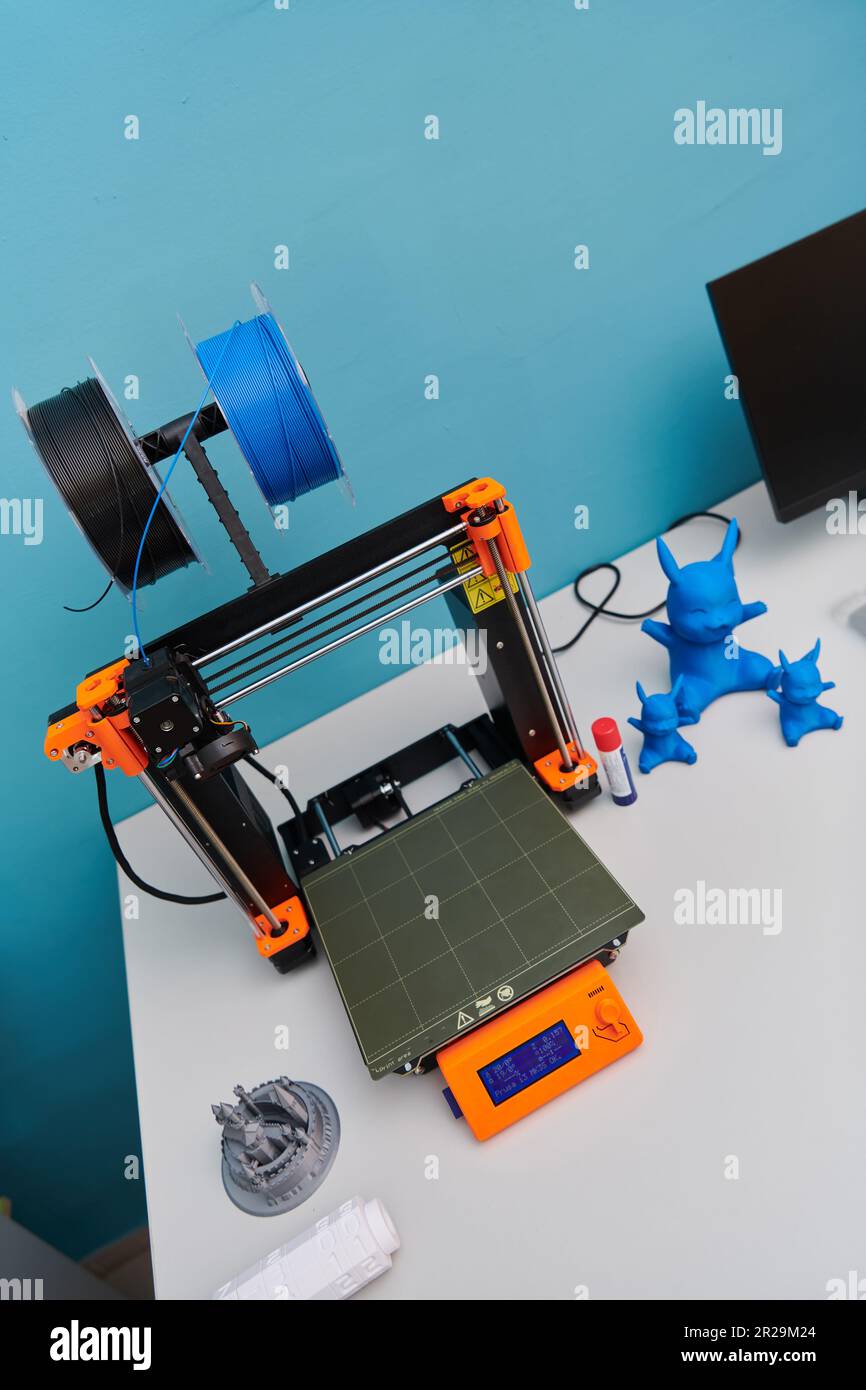 Modern 3d printer for creating 3d models and materials on the table in ...