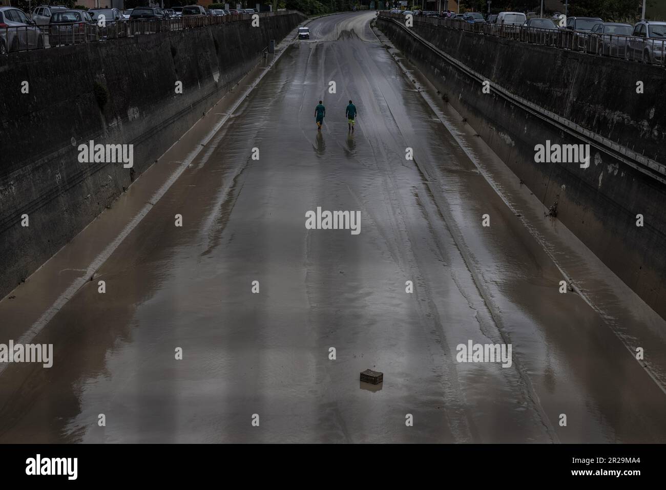 Faenza, Italy. 18th May, 2023. Two workers inspect an underpass which ...