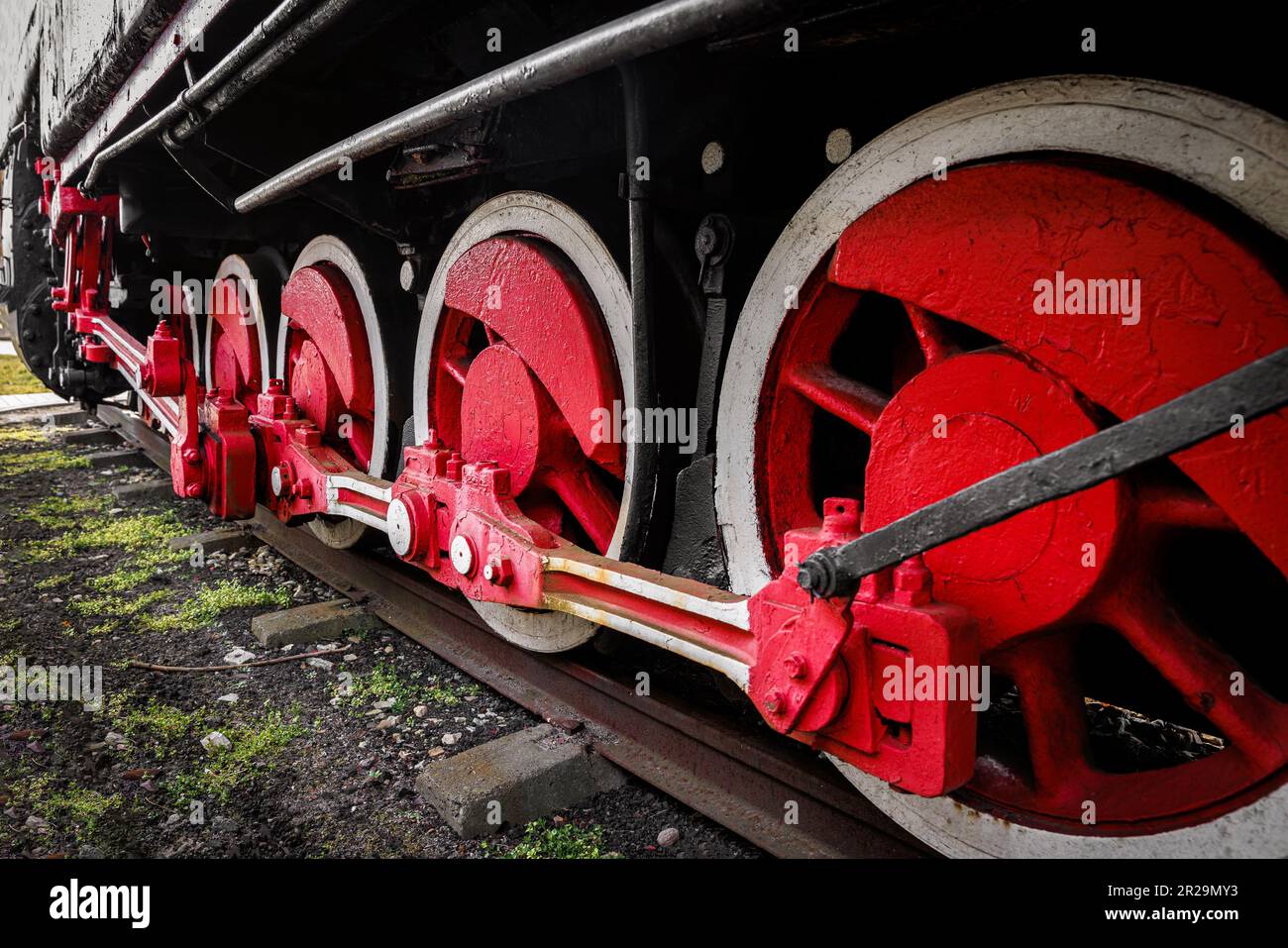Vintage steam train with vibrant red metal wheels Stock Photo - Alamy