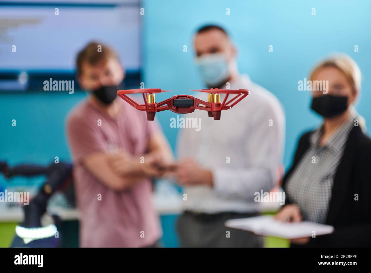 A group of students working together in a laboratory, dedicated to ...