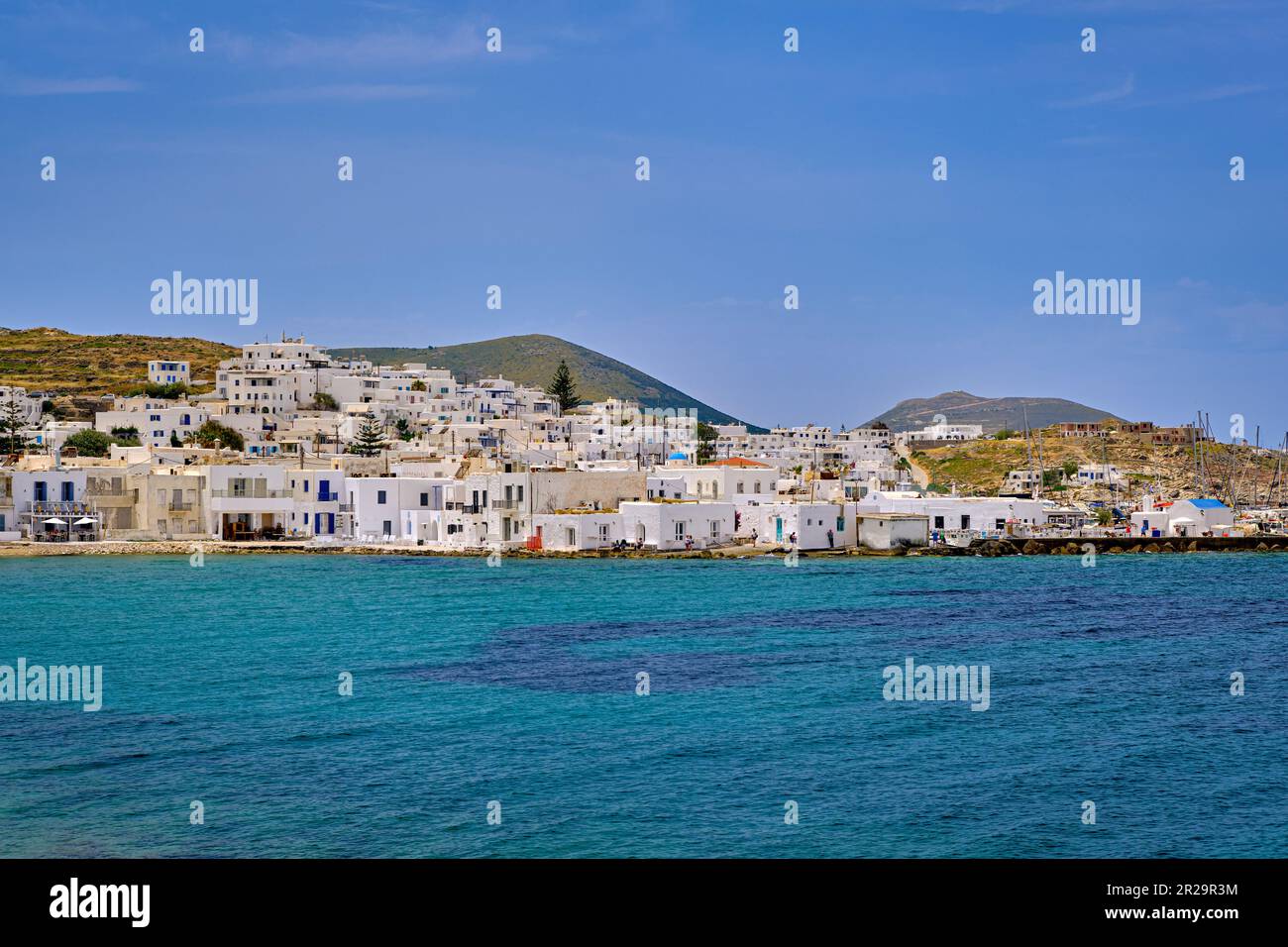 Summer sunshine over Naoussa town, Paros island, Greece. Clear blue sky ...