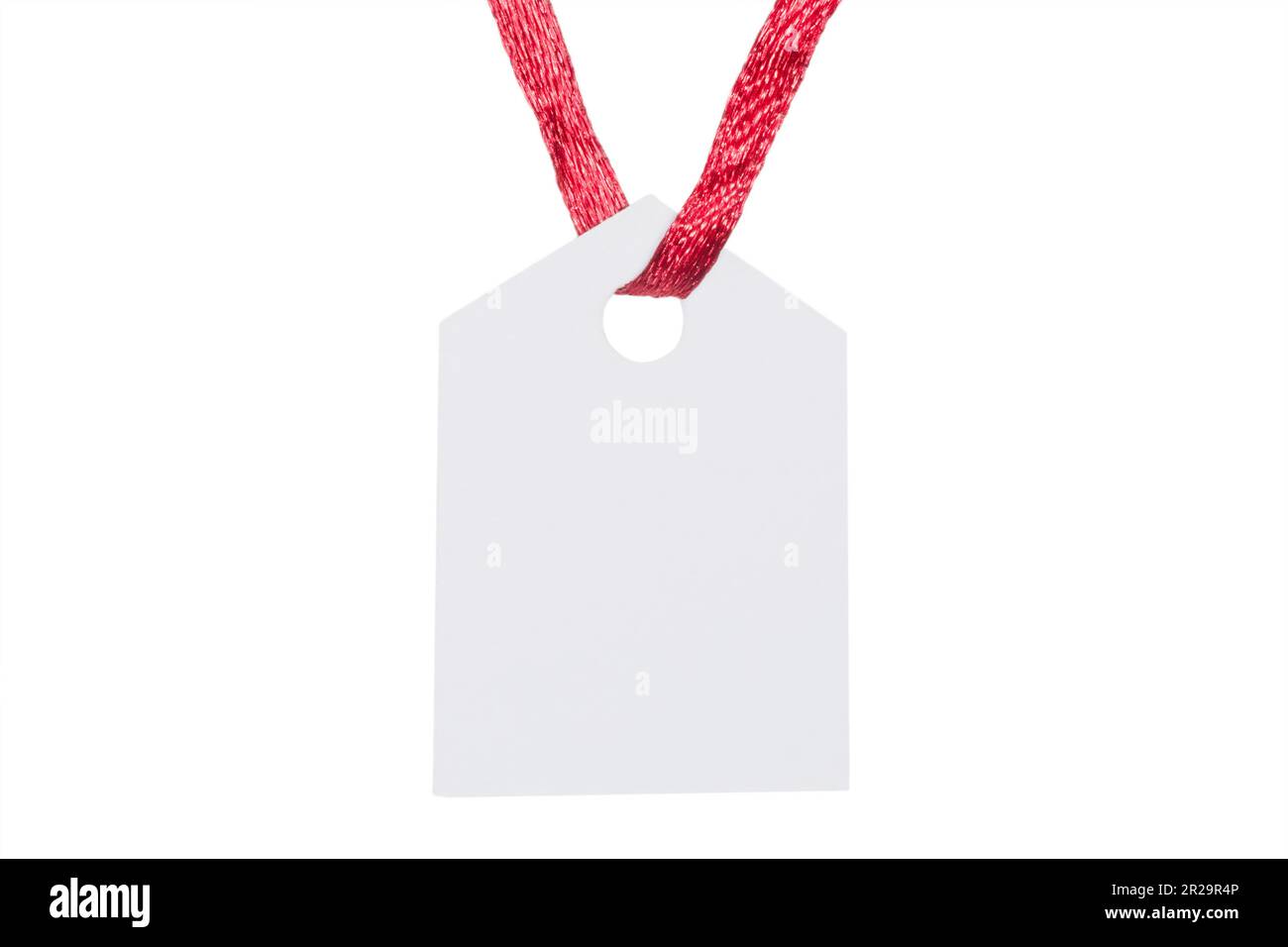 white paper tag hanging on red ribbon against white background Stock ...
