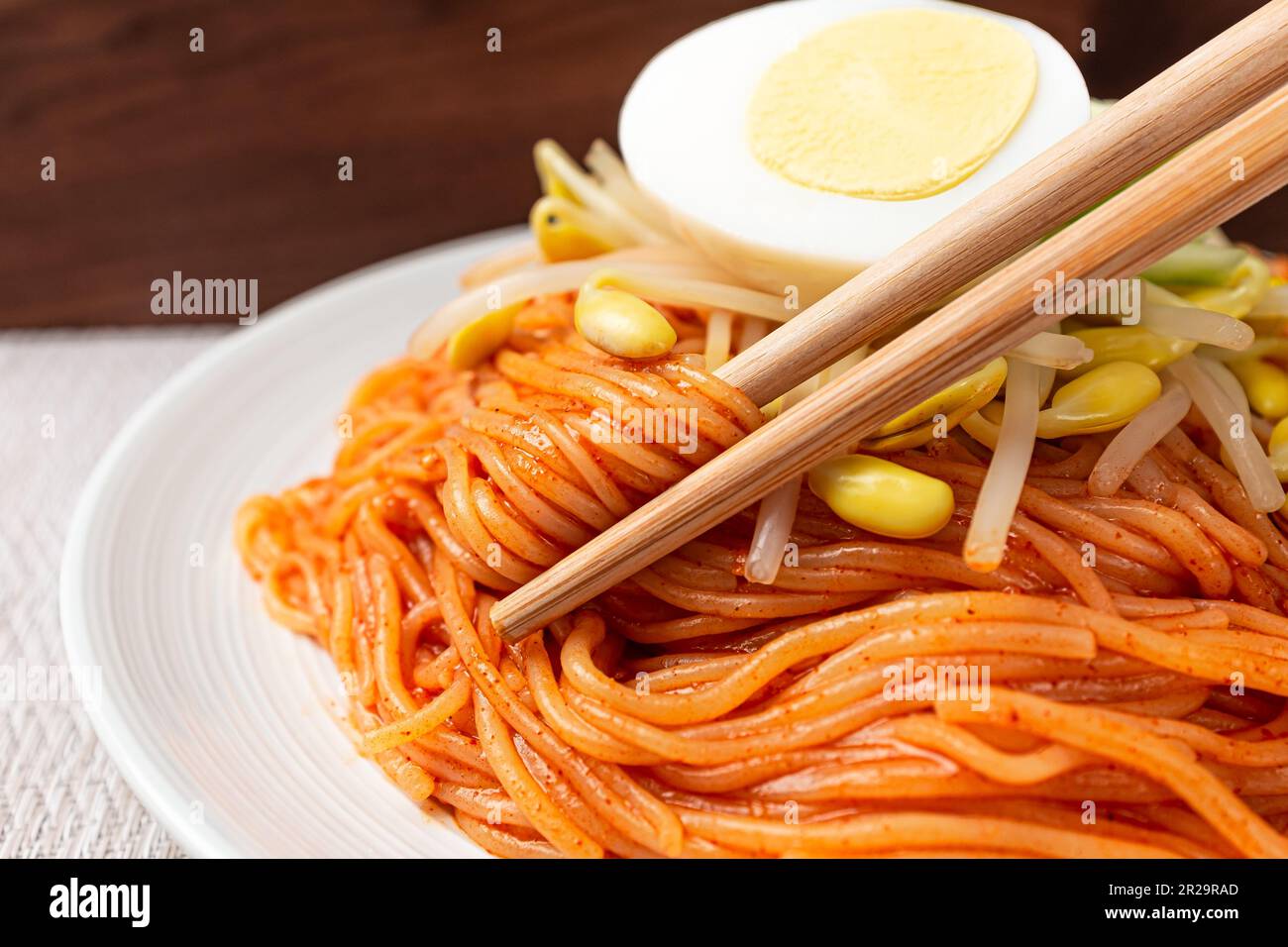 Jjolmyeon made with chewy noodles and spicy seasoning Stock Photo - Alamy