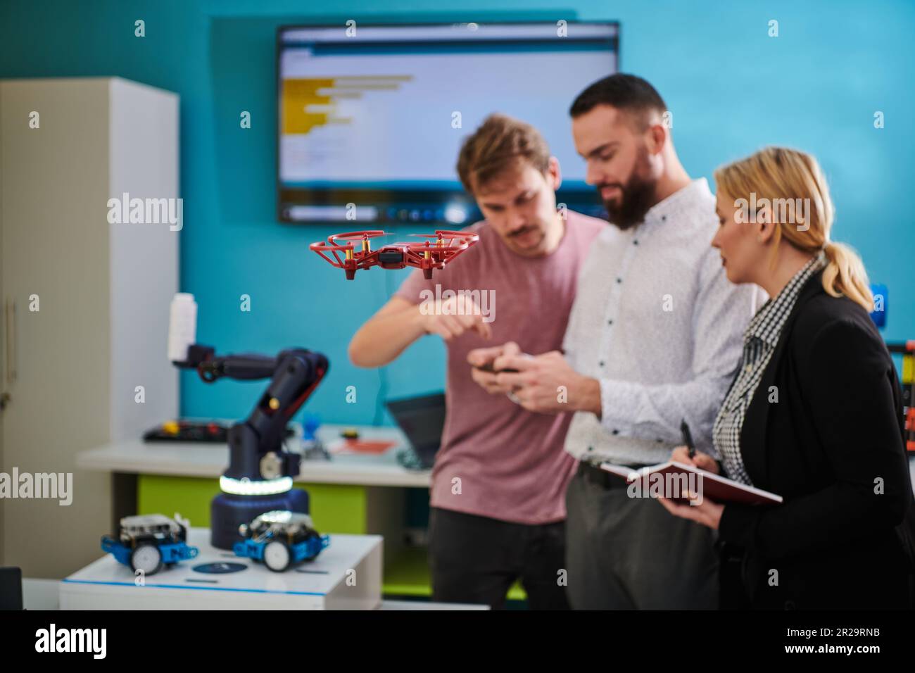 A group of students working together in a laboratory, dedicated to ...