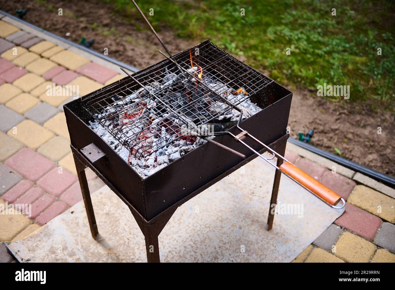 Top view empty grill grate over flaming charcoals on the barbeque grill ...