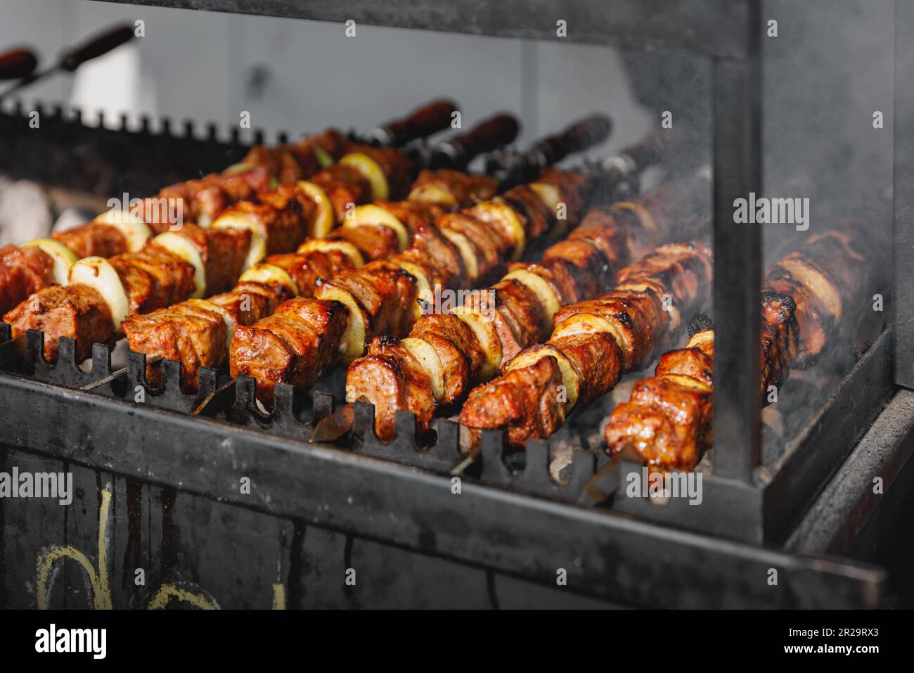 Bbq kebab grilling on open grill during street food festival Stock ...
