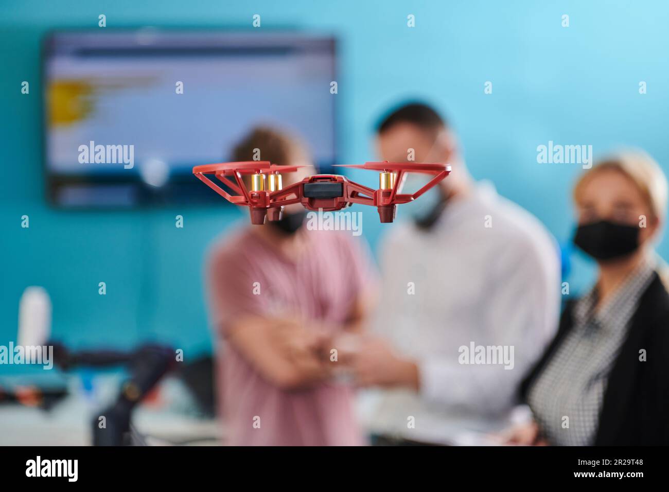 A group of students working together in a laboratory, dedicated to ...