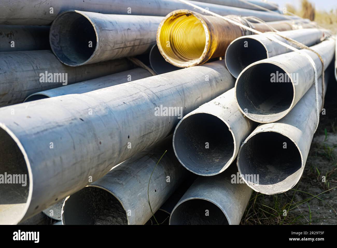 The many big pipes on the ground. PVC pipes bacground Stock Photo - Alamy