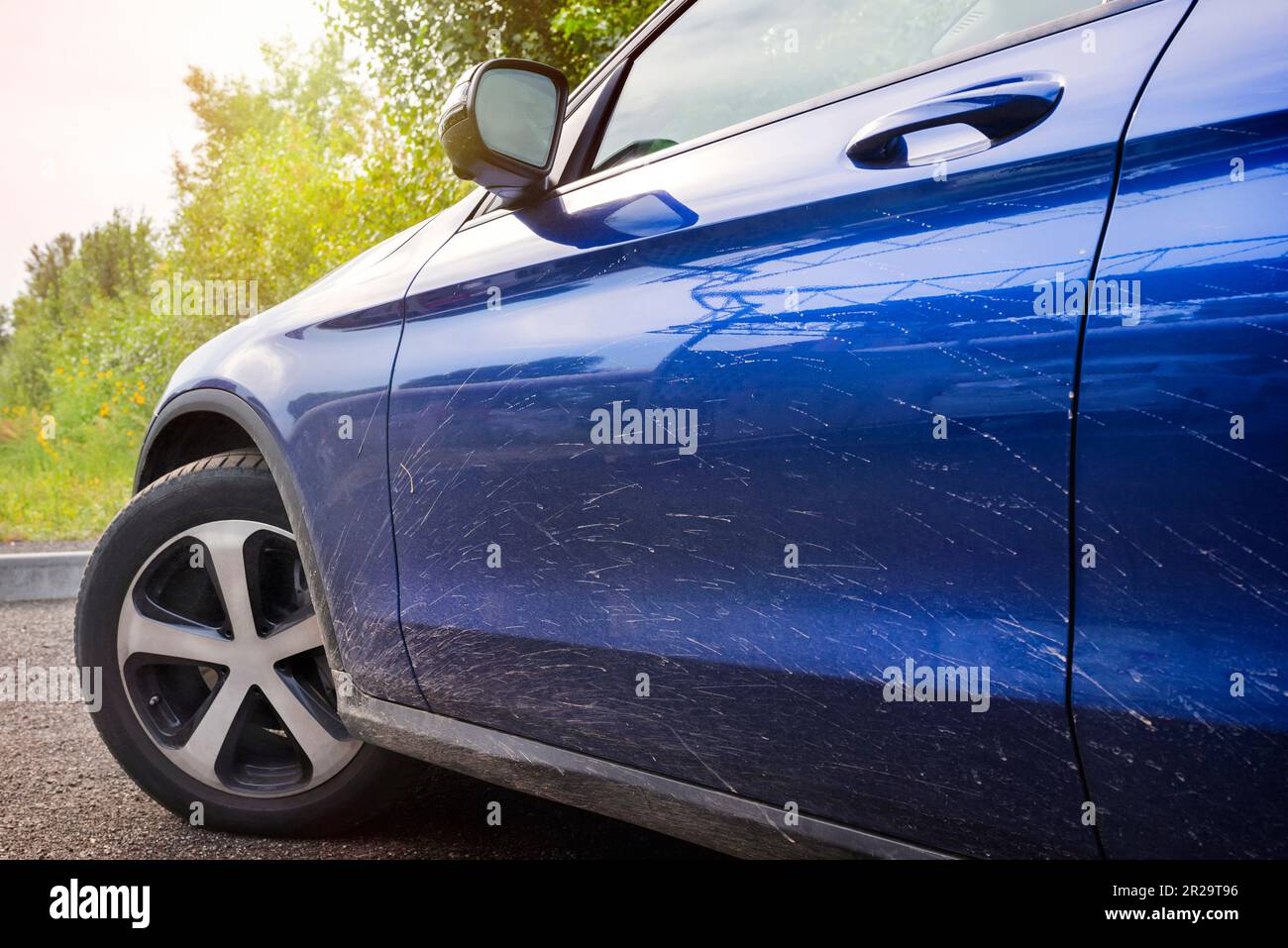Blue car closeup. A look with a side Stock Photo - Alamy