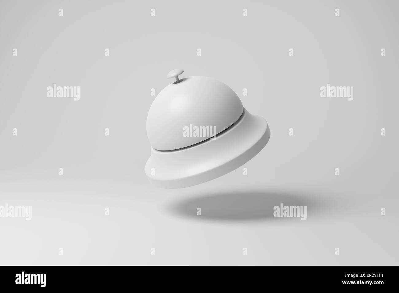 White service bell floating in mid air with shadow in monochrome ...