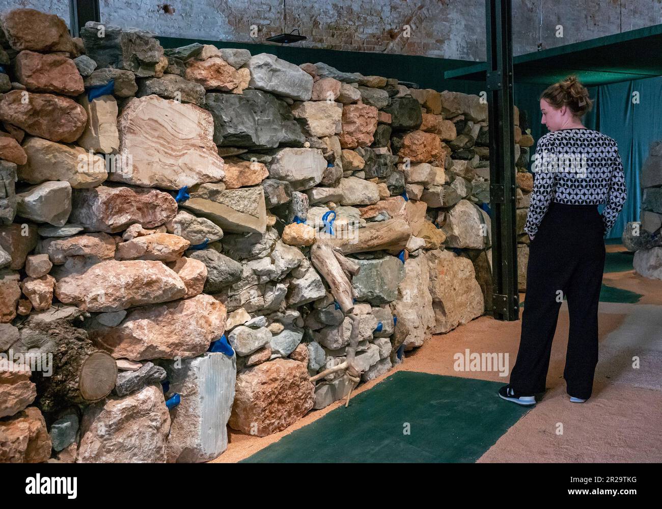 Venice, Italy, 18th May 2023 A visitor looks at an installation inside ...