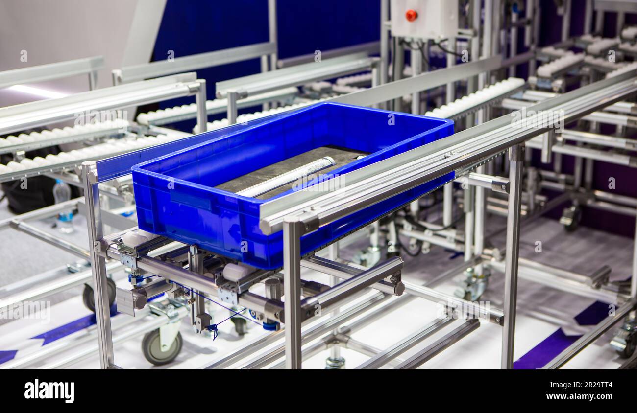 Tray of material parts on conveyor. Industrial warehouse Stock Photo ...