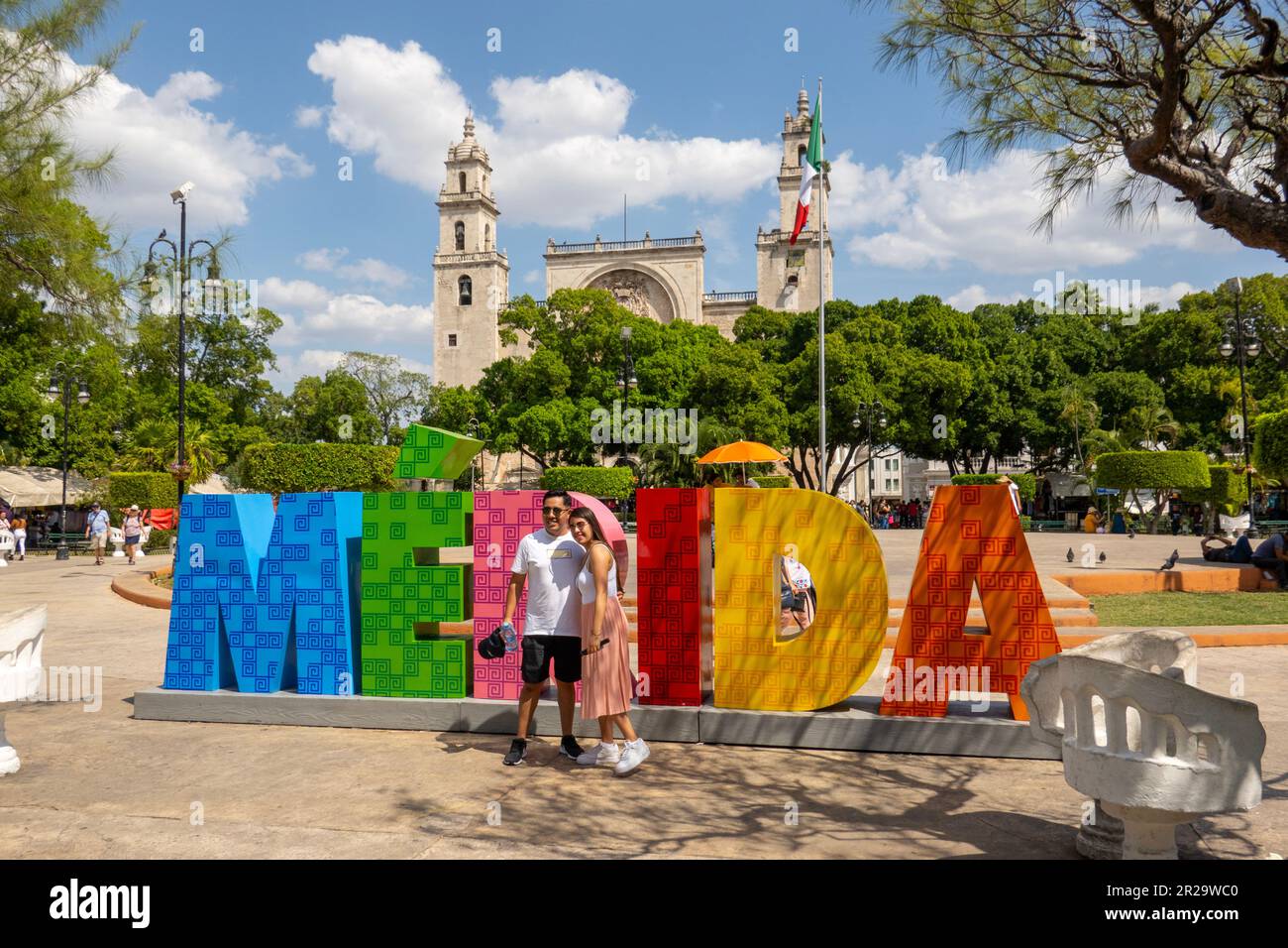 Two bell towers topiary tree trees lights white street hi-res stock ...