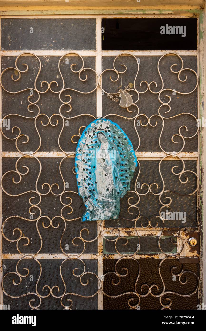 metal security gates on a window in Santiago neighborhood of Merida ...