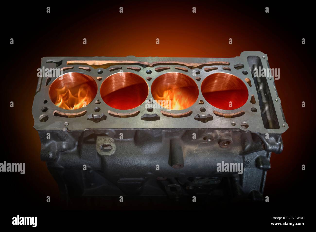 Disassembled engine burning in flames on a dark red background. Repair ...