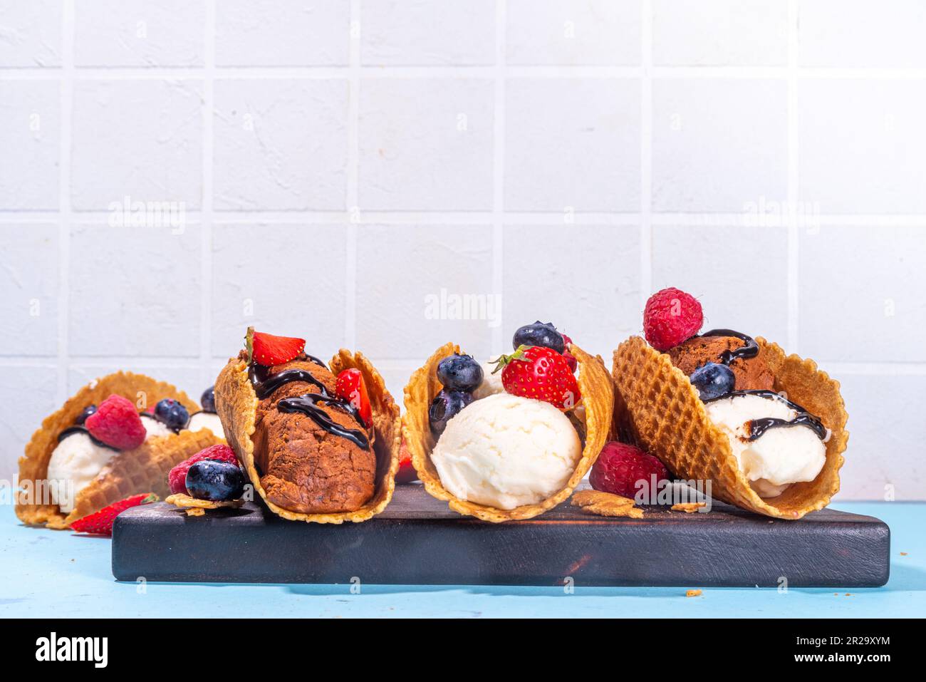 Various sweet taco ice creams. Waffle taco shells with chocolate and ...