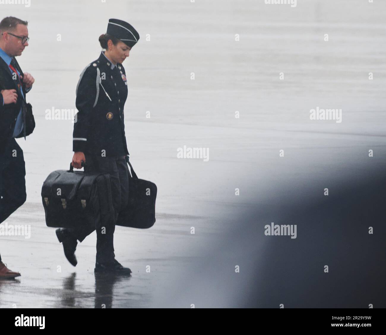 Iwakuni, Japan. 18th May, 2023. U.S. Air Force officer is seen carrying ...