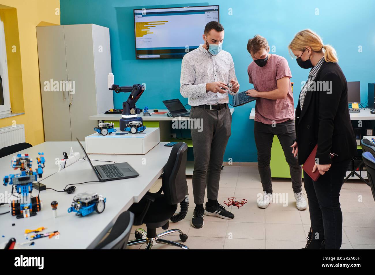 A group of students working together in a laboratory, dedicated to exploring the aerodynamic ...