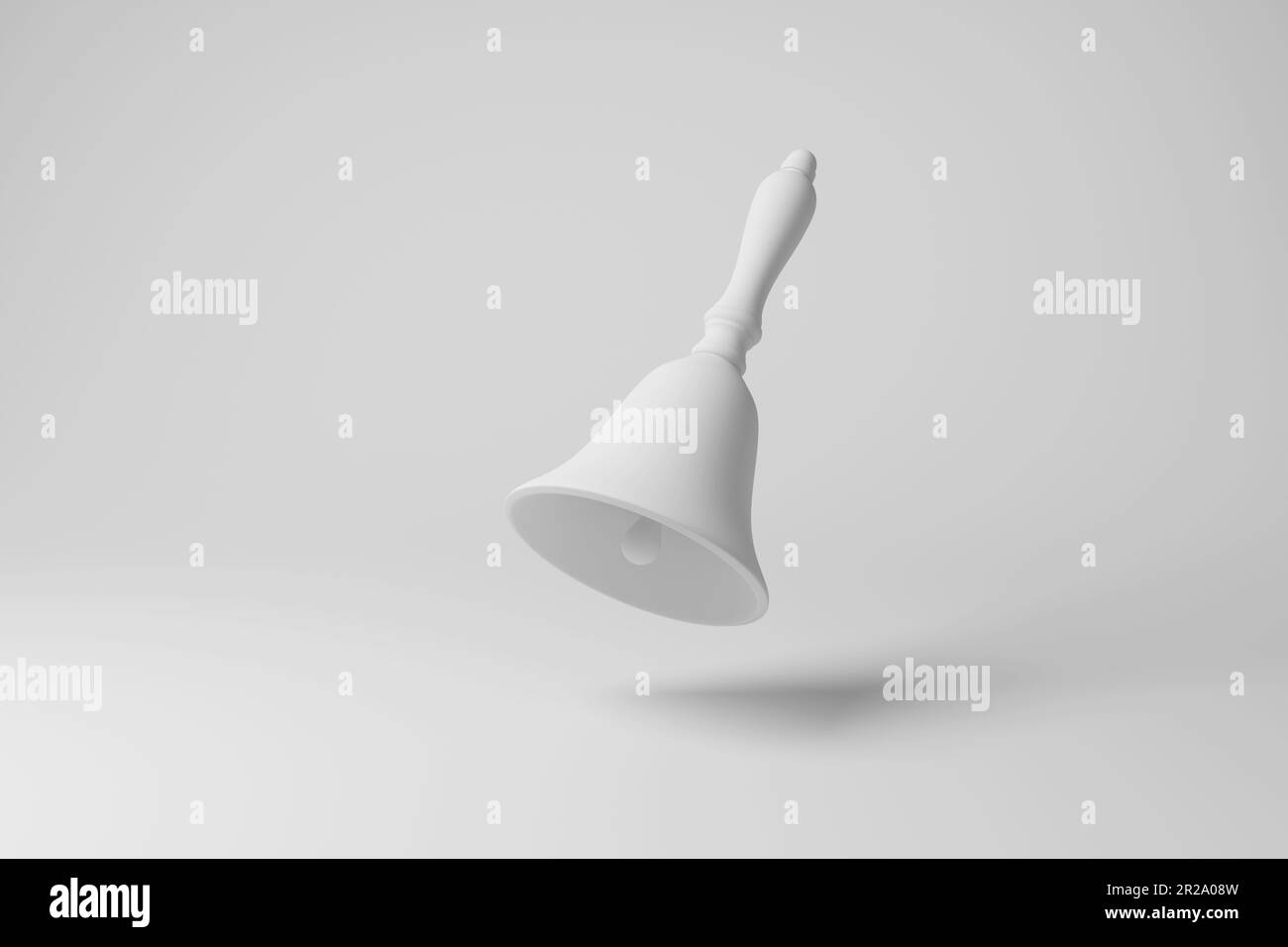 White handbell floating in mid air with shadow on white background in ...