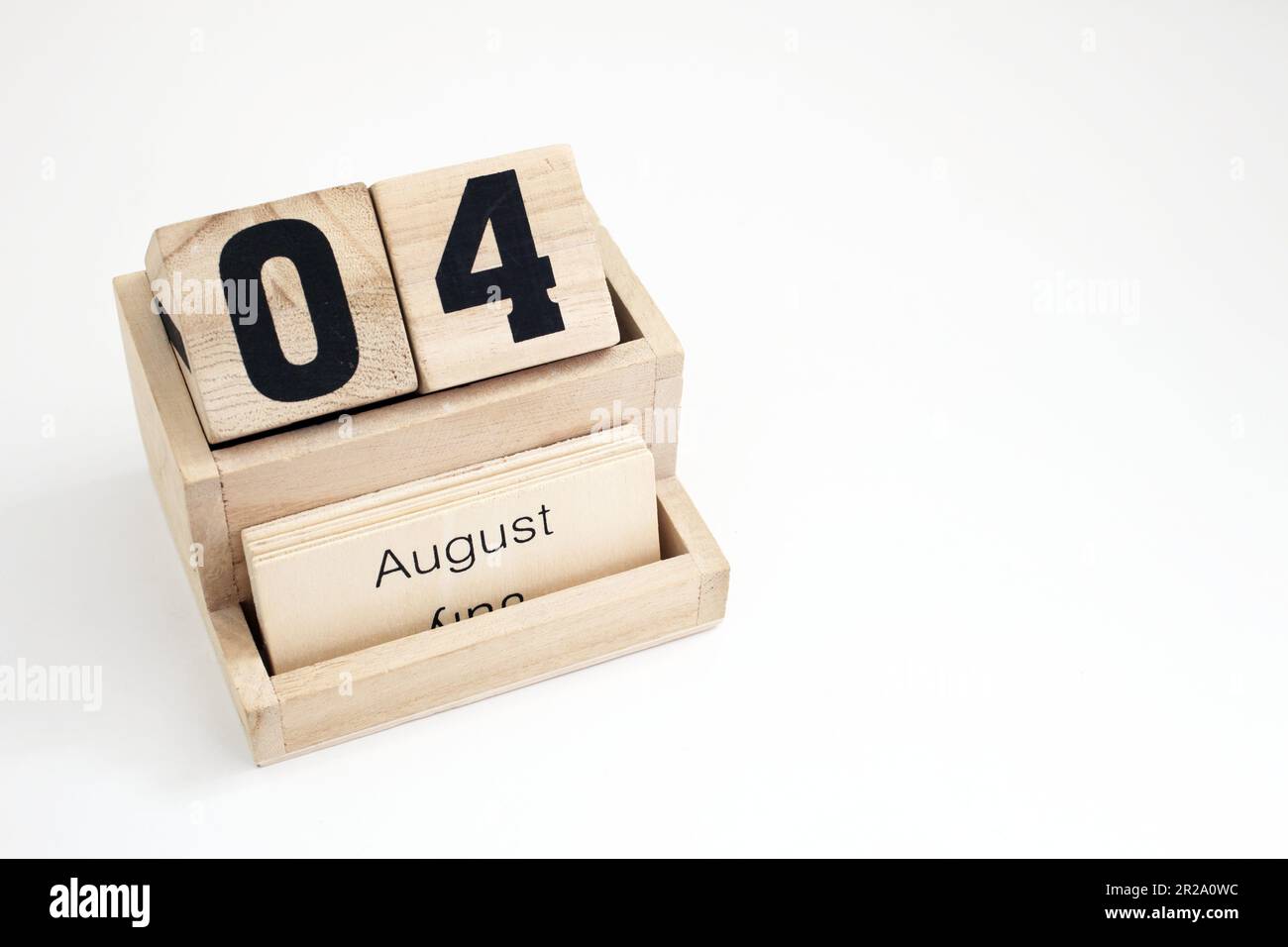Wooden perpetual calendar showing the 4th of August Stock Photo - Alamy