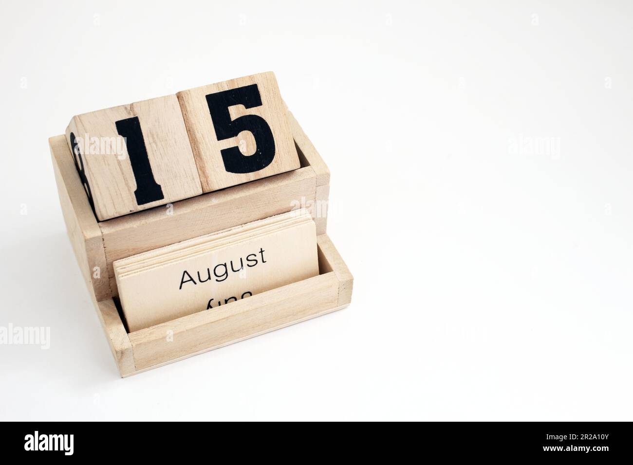 Wooden perpetual calendar showing the 15th of August Stock Photo - Alamy