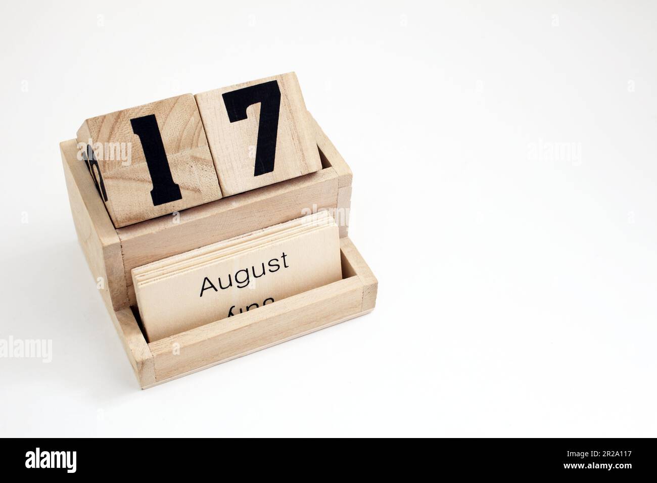 Wooden perpetual calendar showing the 17th of August Stock Photo - Alamy