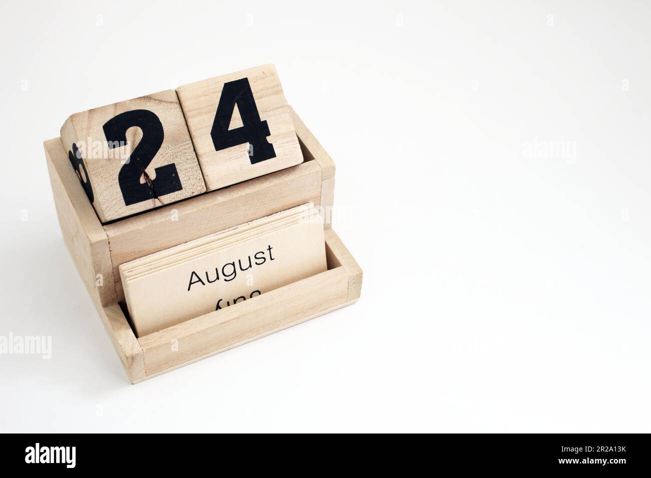 Wooden perpetual calendar showing the 24th of August Stock Photo - Alamy