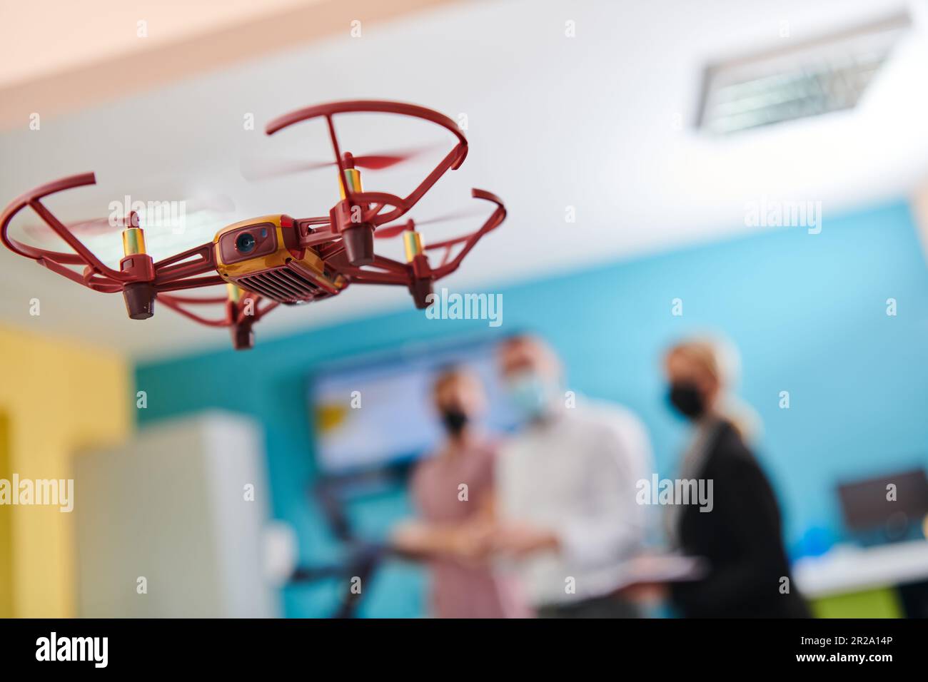A group of students working together in a laboratory, dedicated to ...