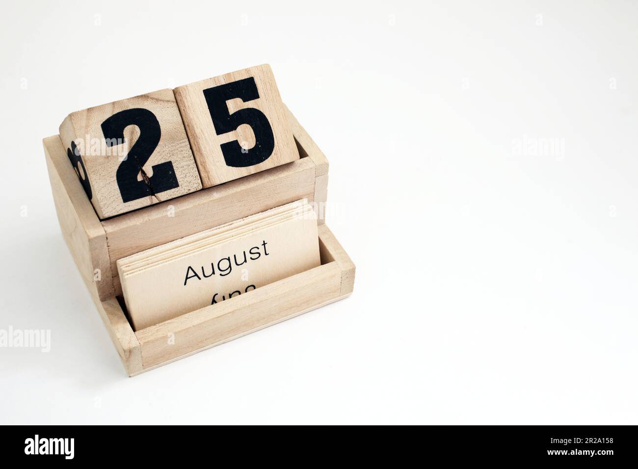 Wooden perpetual calendar showing the 25th of August Stock Photo - Alamy