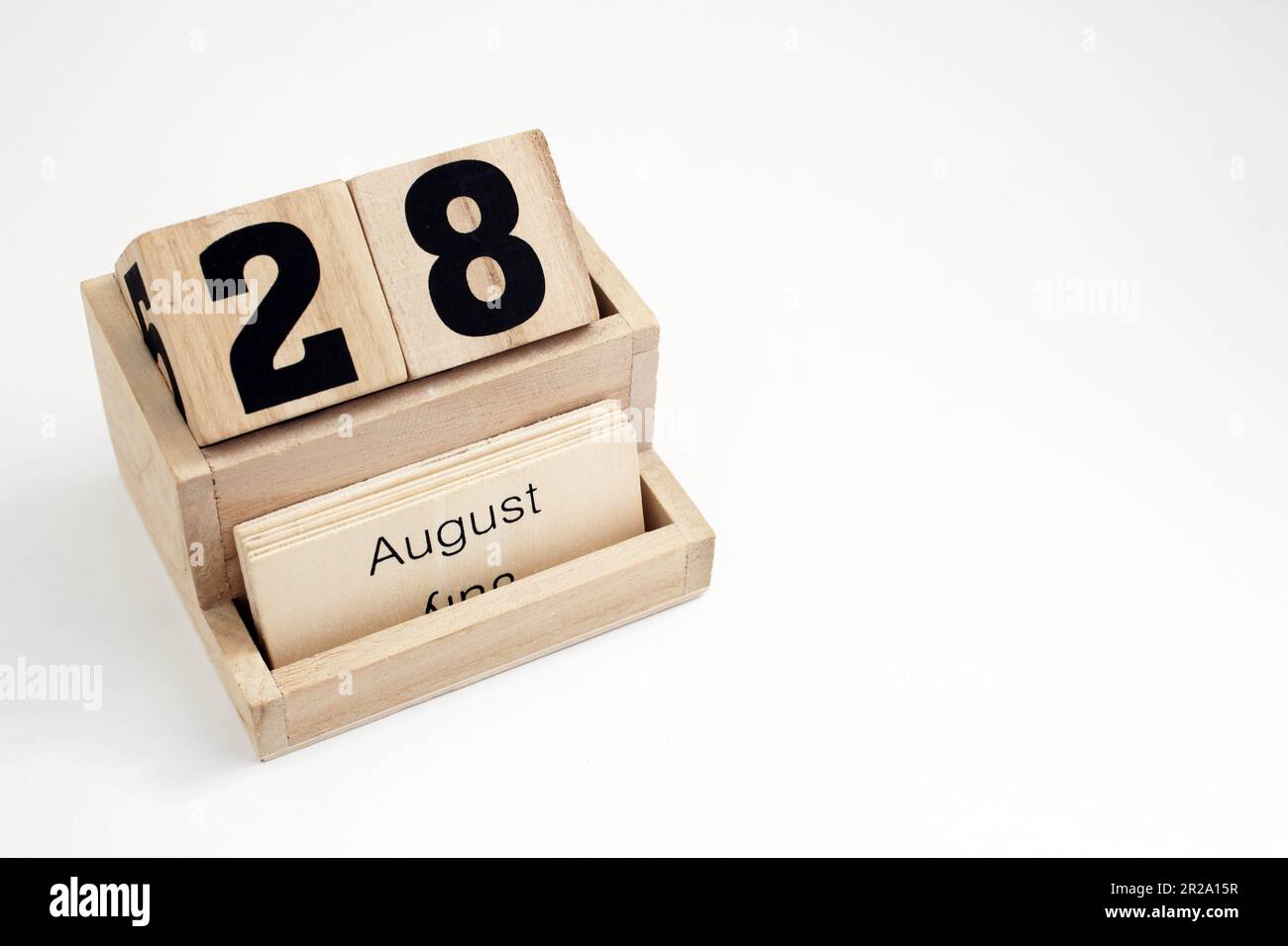Wooden perpetual calendar showing the 28th of August Stock Photo - Alamy
