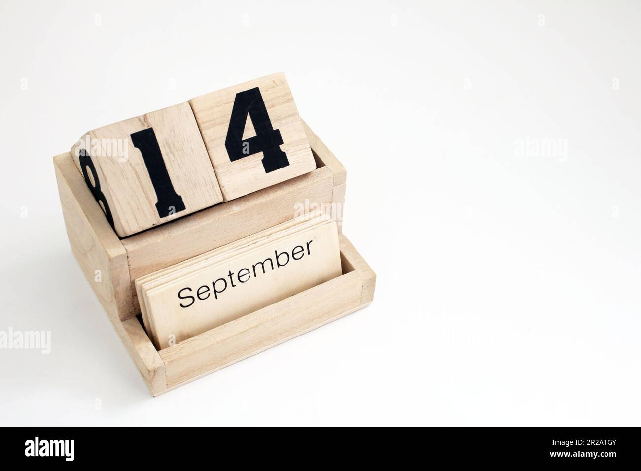 Wooden perpetual calendar showing the 14th of September Stock Photo - Alamy
