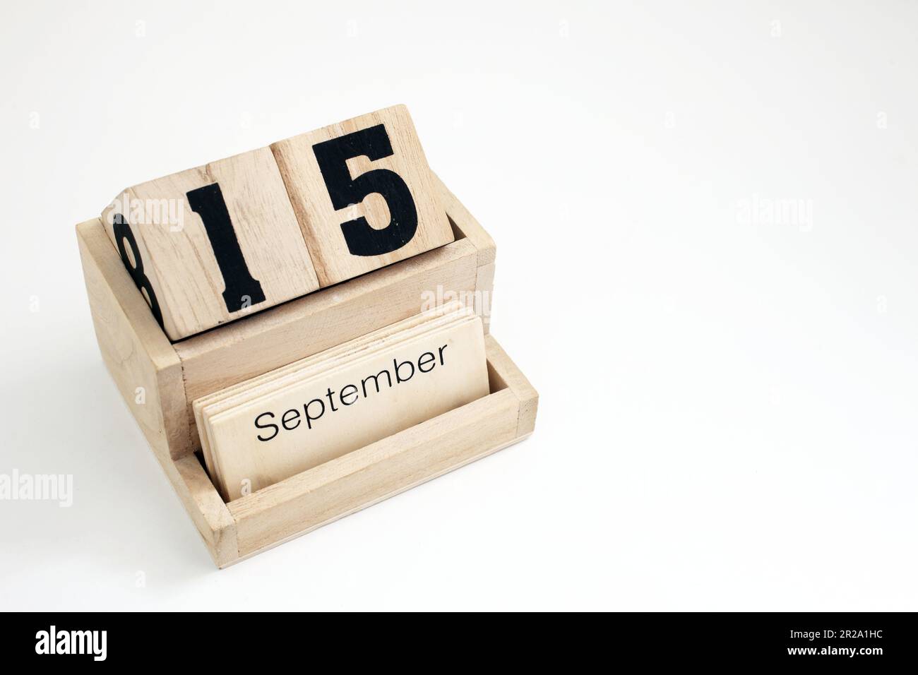 Wooden perpetual calendar showing the 15th of September Stock Photo - Alamy
