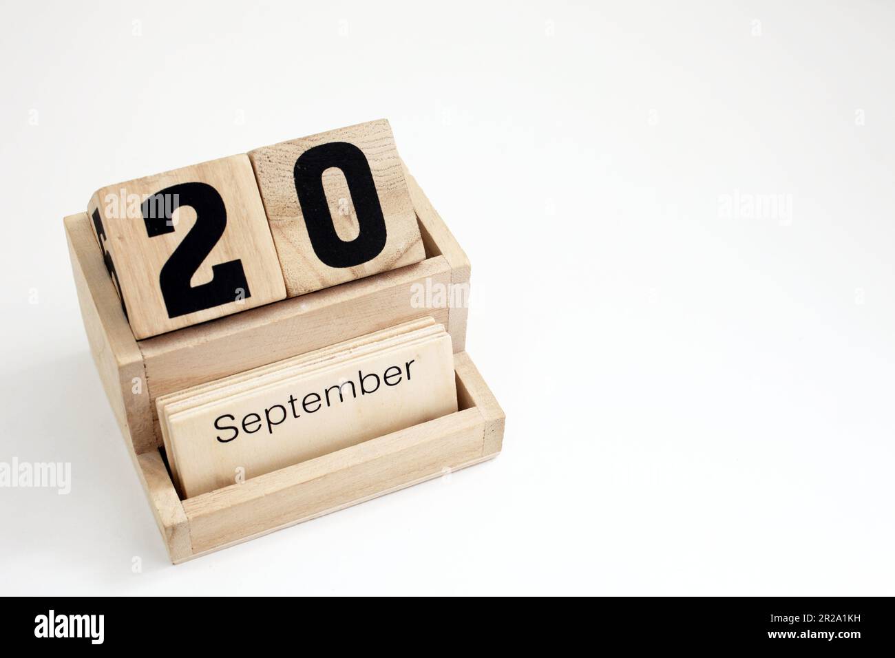 Wooden perpetual calendar showing the 20th of September Stock Photo - Alamy