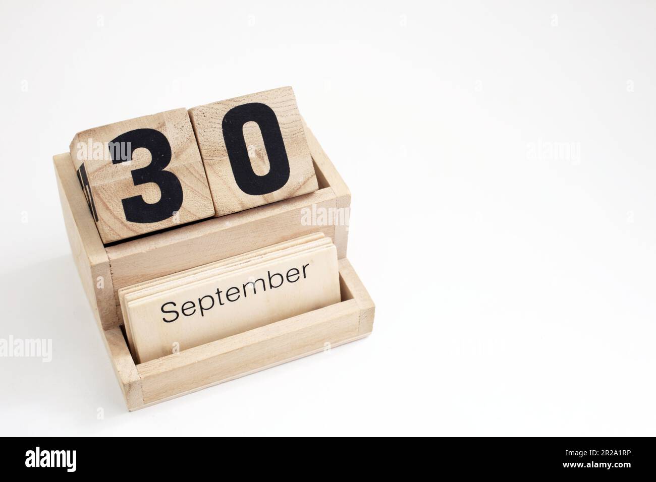 Wooden perpetual calendar showing the 30th of September Stock Photo - Alamy