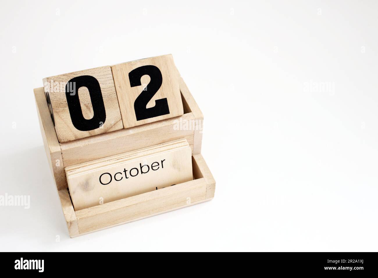 Wooden perpetual calendar showing the 2nd of October Stock Photo - Alamy