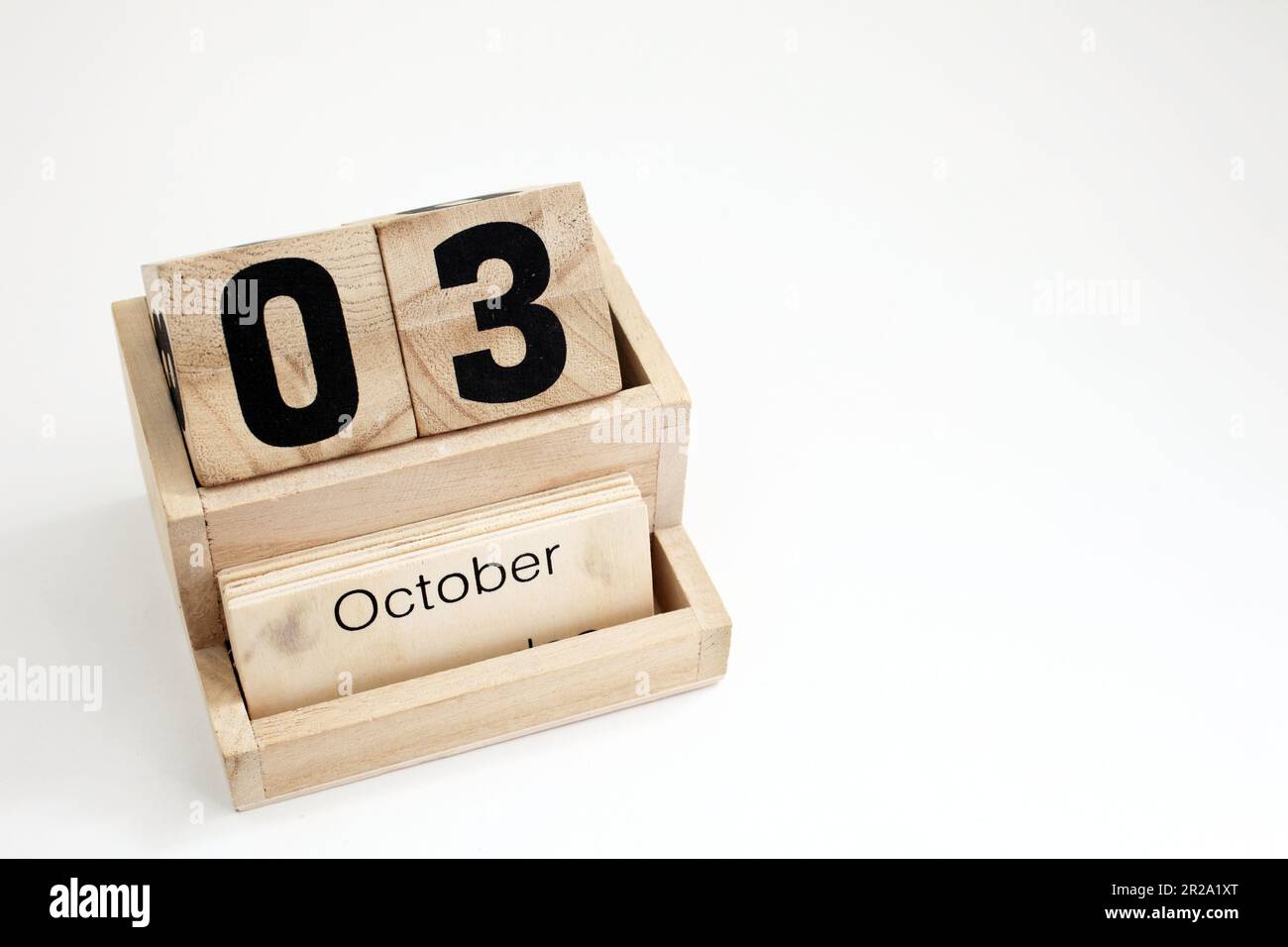 Wooden perpetual calendar showing the 3rd of October Stock Photo - Alamy