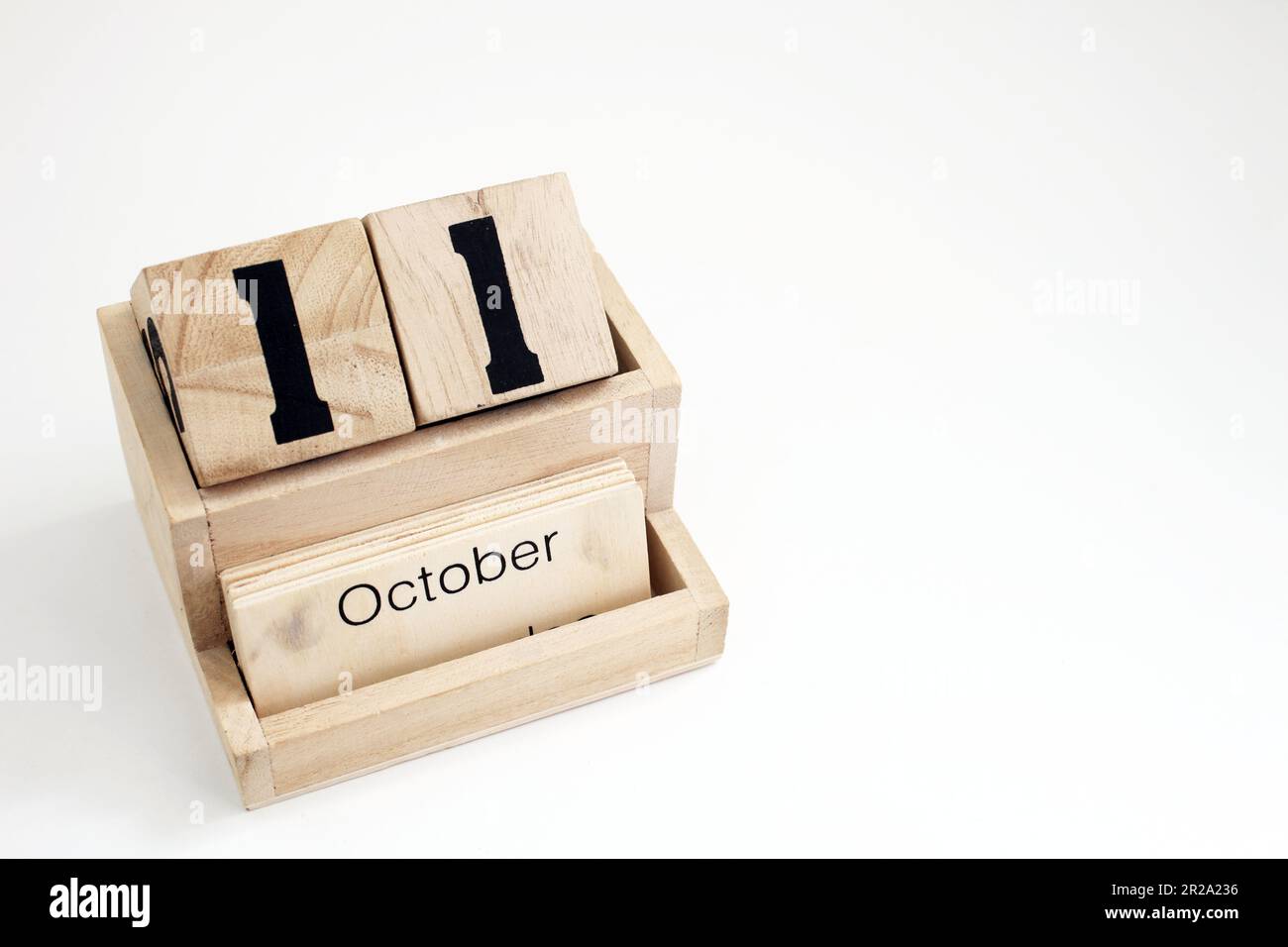 Wooden perpetual calendar showing the 11th of October Stock Photo - Alamy