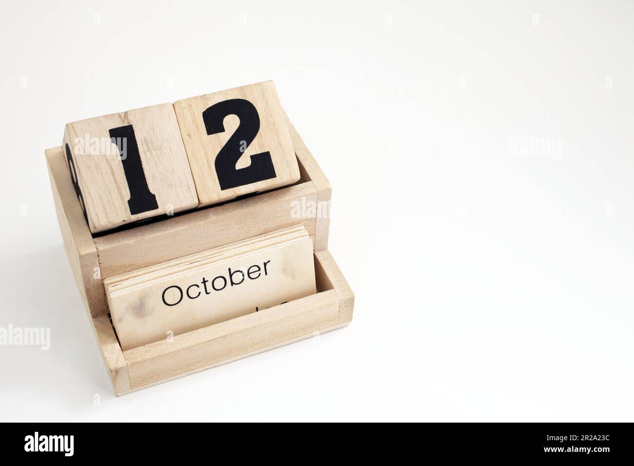 Wooden perpetual calendar showing the 12th of October Stock Photo - Alamy