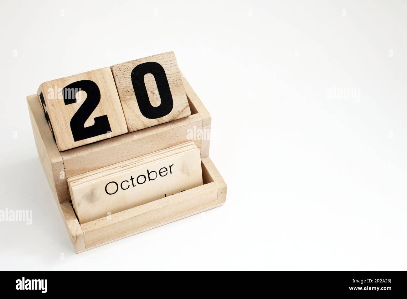 Wooden perpetual calendar showing the 20th of October Stock Photo - Alamy