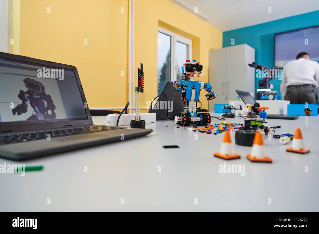 A student testing his new invention of a robotic arm in the laboratory ...