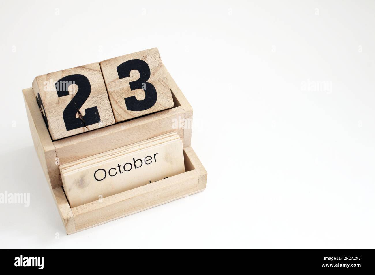 Wooden perpetual calendar showing the 23rd of October Stock Photo - Alamy