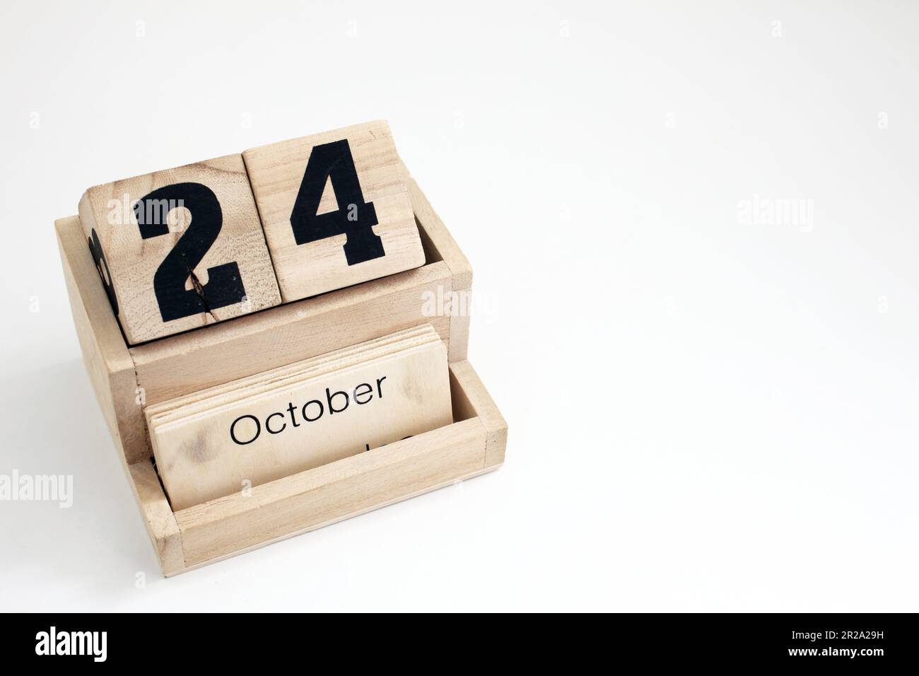 Wooden perpetual calendar showing the 24th of October Stock Photo - Alamy