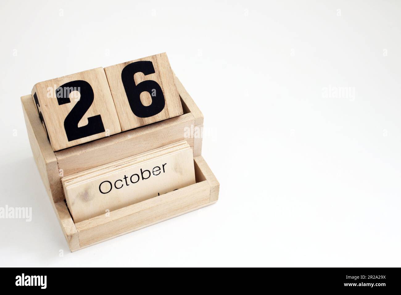 Wooden perpetual calendar showing the 26th of October Stock Photo - Alamy